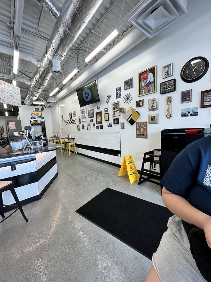 Industrial chic meets comfort food haven inside, where exposed ductwork watches over burger magic happening below.