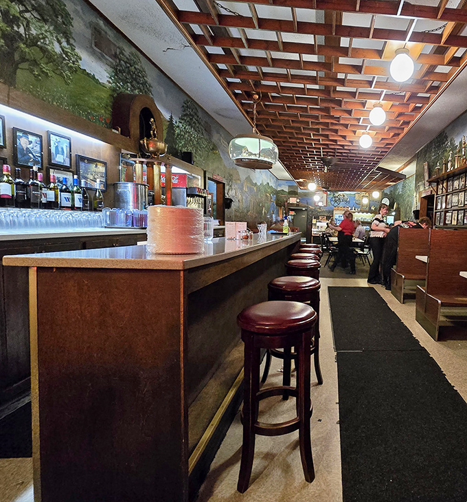 Step inside and you're transported to old-world Italy with wooden lattice ceilings, cozy booths, and murals that make you feel like family before you've even ordered.