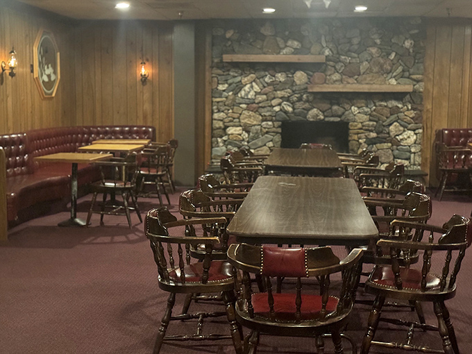 Classic steakhouse ambiance done right—wood paneling, stone fireplace, and those red leather booths that have witnessed countless celebrations, first dates, and "I can't believe I ate the whole thing" moments.