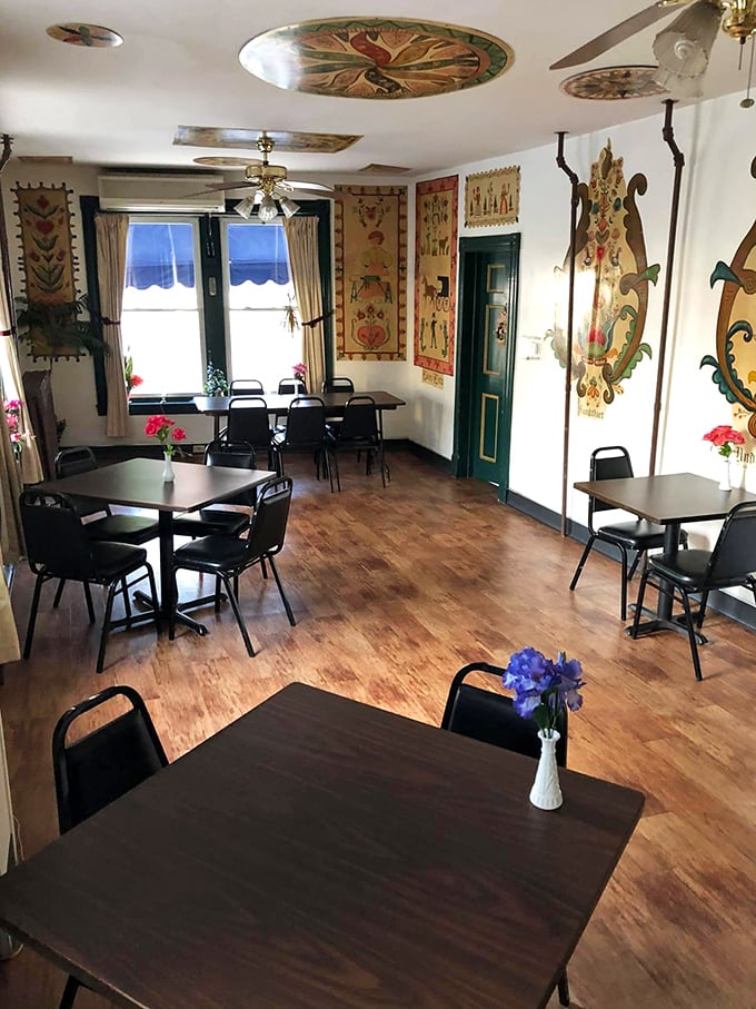 Step inside to a world where folk art tapestries and hex signs transform simple dining spaces into a living museum of Pennsylvania Dutch culture.