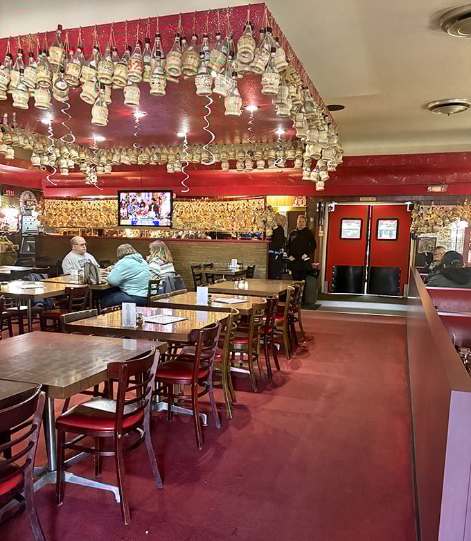 Hundreds of Chianti bottles hang from the ceiling like trophies of meals past. This isn't d&eacute;cor&mdash;it's a visual history of good times and great pizza.