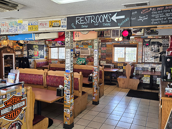 License plate heaven meets comfort food paradise. The interior feels like the coolest roadside museum that happens to serve incredible food.
