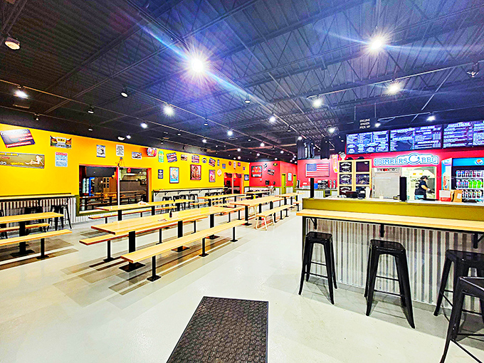 Inside, vibrant yellow and red walls create a lively backdrop for the serious business of barbecue consumption. The picnic-style seating practically demands making new friends.