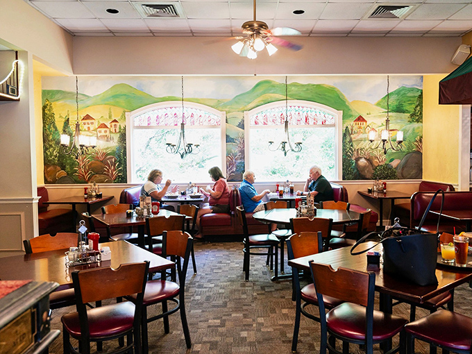 Italian countryside murals transport diners to Tuscany while comfortable booths invite lingering conversations over plates of pasta perfection.