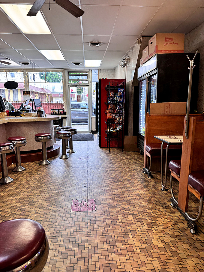 The classic diner interior at Lou's feels like stepping into a time capsule. Those vintage counter stools have supported generations of happy eaters.