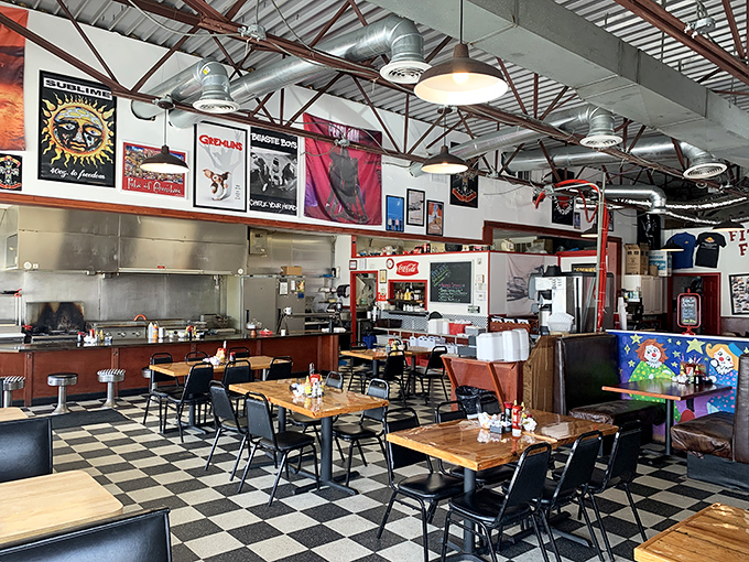 Rock posters meet checkered floors in this time capsule of Americana. The open kitchen layout lets you witness breakfast alchemy in real time.