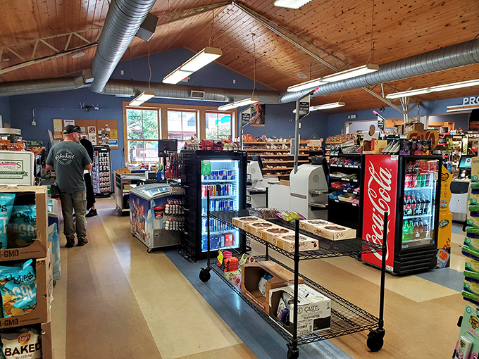Inside, the warm wooden ceiling and well-stocked shelves create that perfect small-town market vibe—part grocery store, part treasure hunt.
