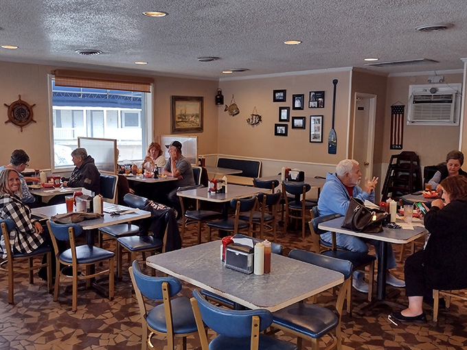 No-frills nautical charm sets the stage where conversations flow as freely as the sweet tea. Those blue chairs have witnessed countless seafood celebrations.
