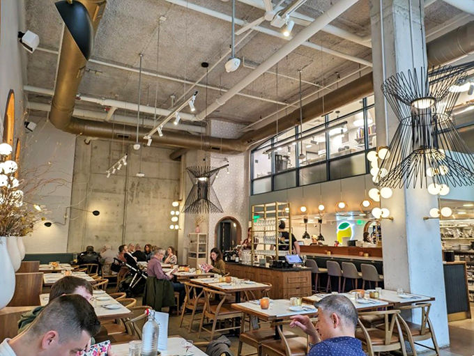 Industrial chic meets Italian warmth in Speck's airy dining room. Those sculptural light fixtures aren't just illuminating your pasta&mdash;they're conversation starters that rival the food.