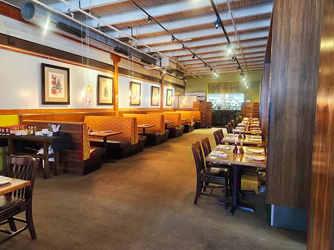 License plates from everywhere tell stories while colorful chairs promise your meal will be anything but boring.