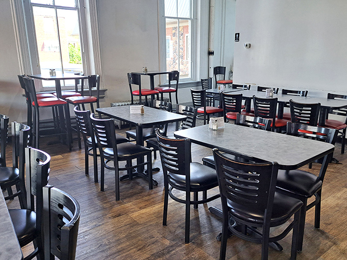 Simple elegance meets homestyle comfort in Mamie's dining room, where those red-cushioned chairs have supported generations of satisfied breakfast enthusiasts.