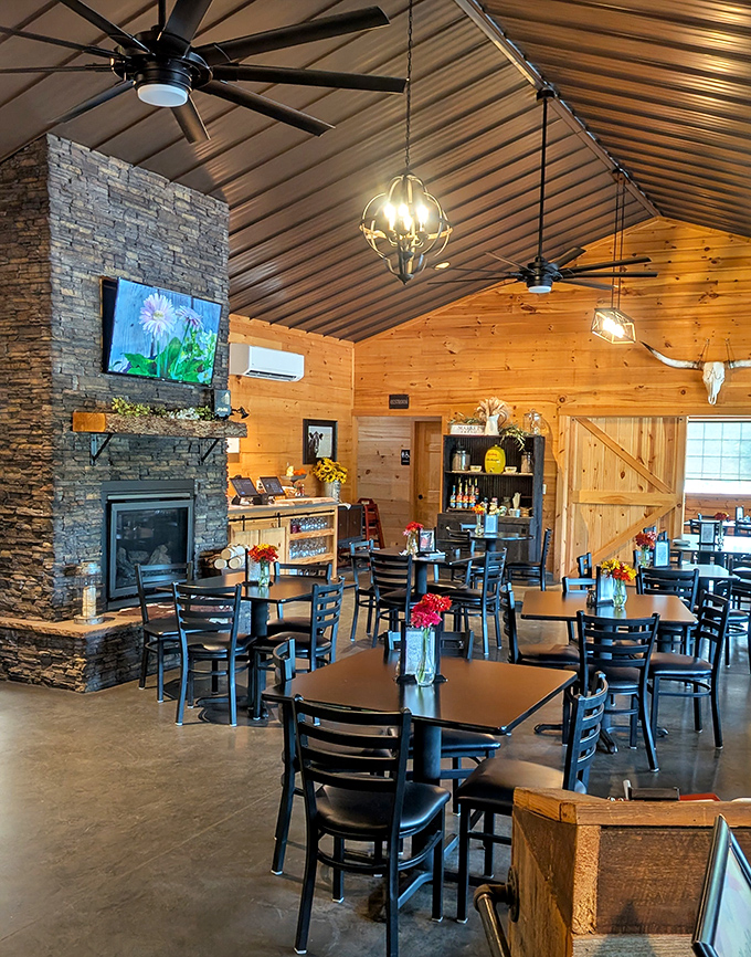 Rustic elegance meets cozy comfort in this wood-paneled dining room. That stone fireplace isn't just for show—it's practically begging you to linger over dessert.
