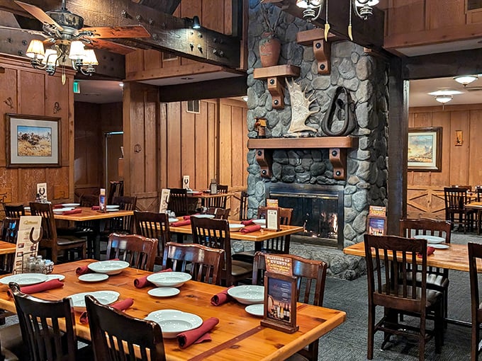 Step inside and you're transported to a rustic Western paradise where the stone fireplace and wooden beams promise comfort before your steak even arrives.