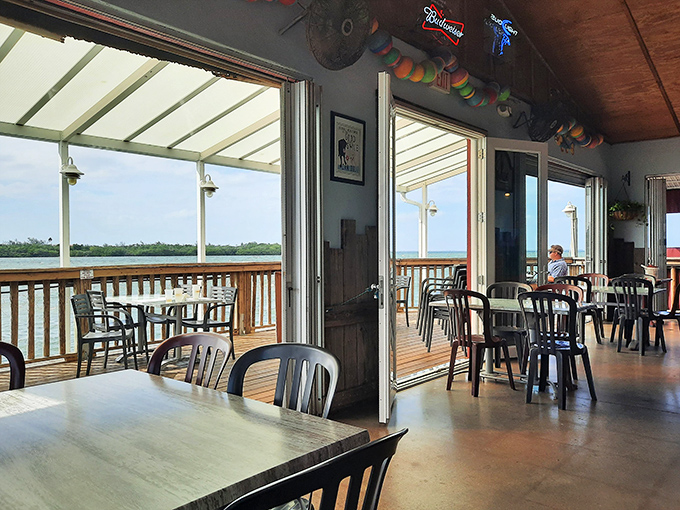 Where the food meets the view. Simple tables, plastic chairs, and a million-dollar panorama of Sarasota Bay that no interior designer could improve upon.