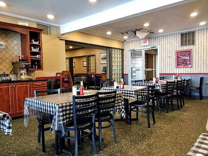 Black and white checkered tablecloths set the stage for culinary nostalgia. This isn't manufactured retro charm&mdash;it's the real deal, earned through decades of service. 