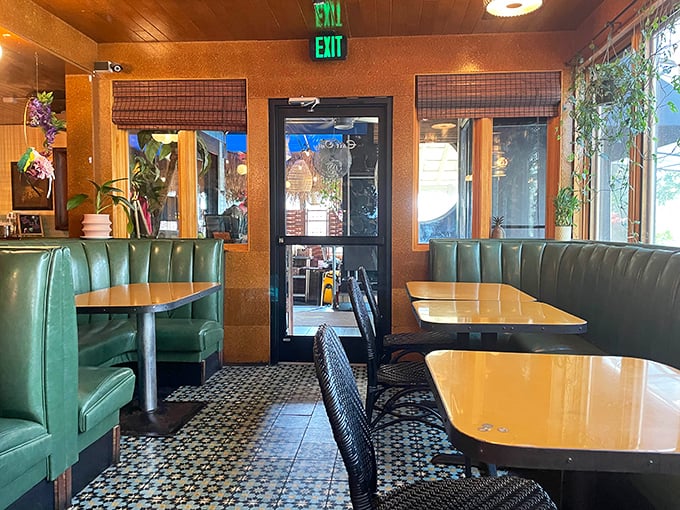 Retro turquoise booths and warm wood tones create that perfect "vacation in your hometown" vibe that makes every meal feel special.