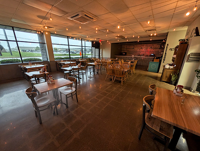 String lights cast a warm glow across wooden tables, creating that perfect sweet spot between "trendy brunch spot" and "your favorite aunt's dining room."