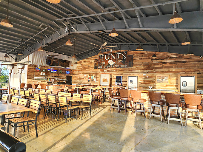 Two-story elegance meets old-world charm in this dining room where globe lights float like full moons above tables dressed in their formal whites.