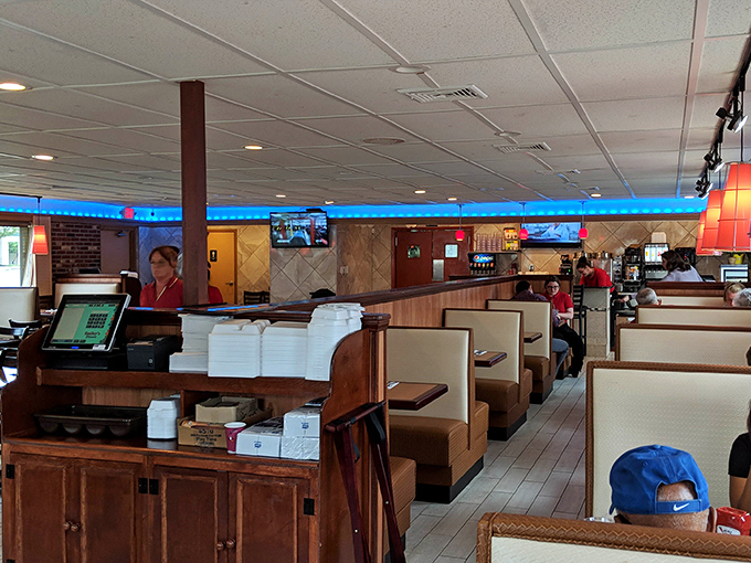 Classic booth seating and that signature blue lighting create the perfect backdrop for life's most important decisions: pancakes or waffles?