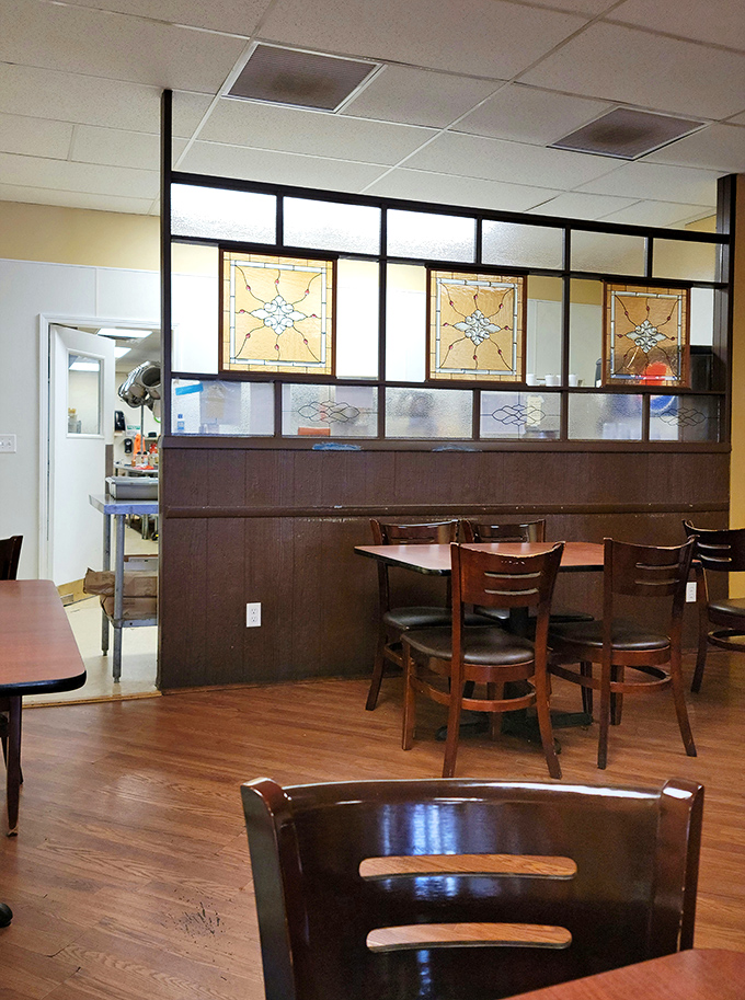 Vintage stained glass dividers add character without pretension. This isn't designer ambiance&mdash;it's the real deal, where conversations matter more than Instagram opportunities. 