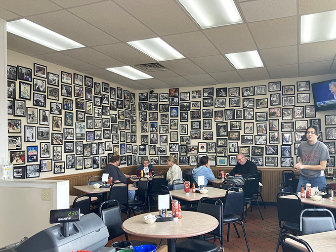 Wall-to-wall memories frame every meal here. This photo gallery isn't curated by an art director&mdash;it's a genuine community scrapbook spanning decades.