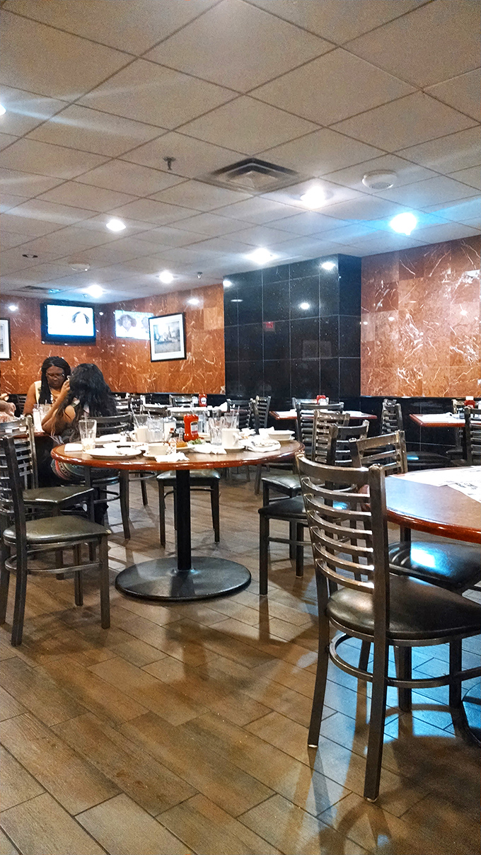 Classic diner elegance with marbled walls and comfortable seating&mdash;where conversations flow as freely as the coffee.