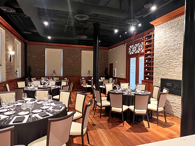 Exposed brick walls meet elegant place settings in this dining room where conversations flow as smoothly as the wine. Every table feels like the best seat in the house.