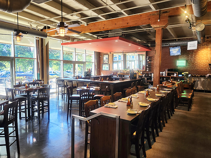 Industrial chic meets Southern comfort in this airy dining space. Wooden beams and brick walls create the perfect backdrop for barbecue bliss.