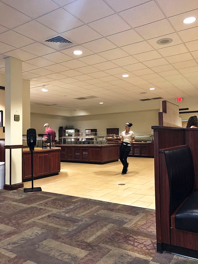 Inside, the buffet area gleams with promise, where staff members orchestrate a symphony of home-cooked delights that keep locals coming back for decades.