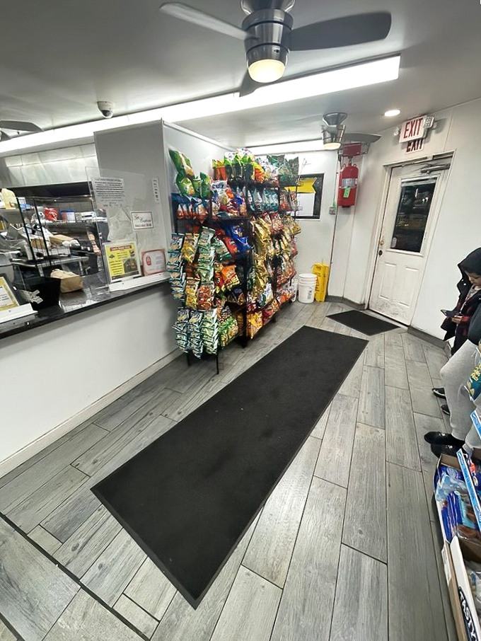 No-frills interior with a snack rack standing guard. This is a temple of taste where function trumps fashion and appetites come to worship.