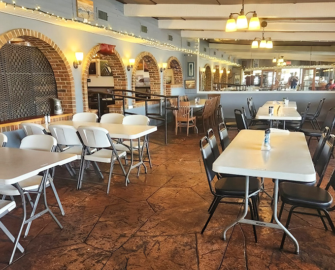 Brick archways and simple tables create that rare atmosphere where both grandparents and grandkids feel equally at home. Comfort with a view.
