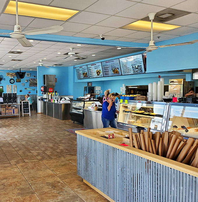 The bright blue walls and casual setup scream "roll up your sleeves" &ndash; this is serious crab business.