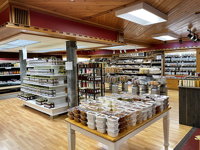 Inside Heini's, wooden beams frame a wonderland where jams, jellies, and local treats stand ready to complement your cheese haul. Restraint? What restraint?