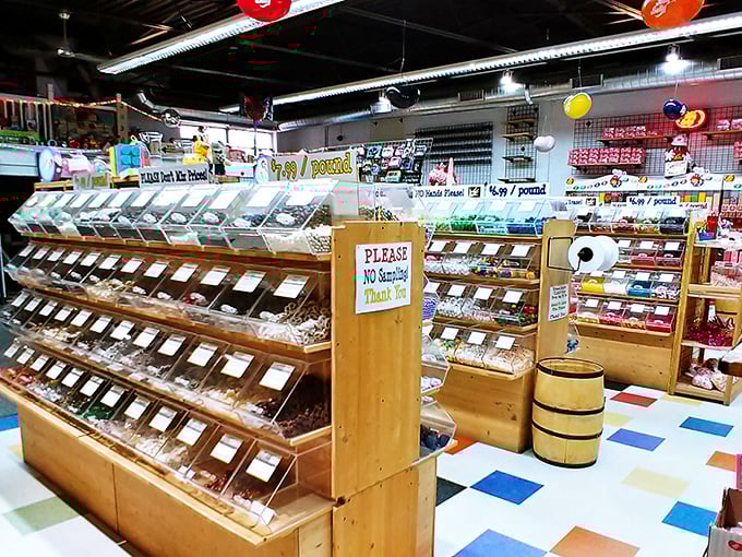 Wooden bins filled with temptation line the aisles, where the "No Sampling" sign might be the most optimistic piece of retail signage ever created.