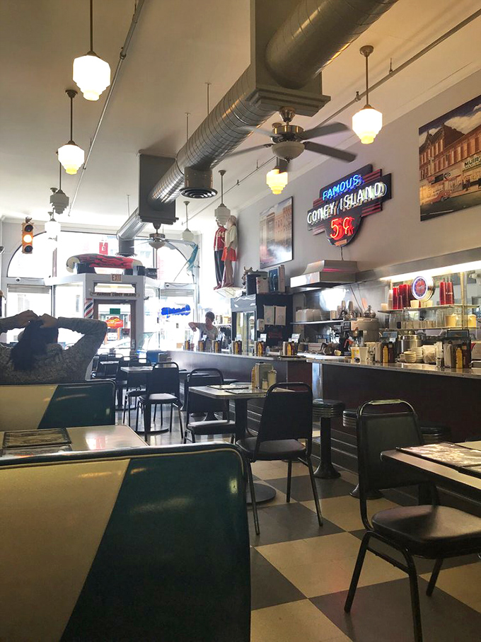 Classic checkerboard floors, pendant lights, and green vinyl booths &ndash; not designed to look vintage, they simply are the real deal.