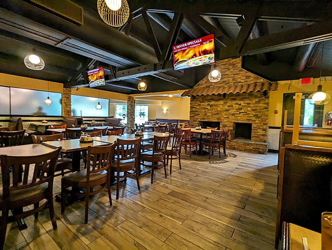 Rustic wooden beams meet stone accents in this dining room that somehow manages to feel both spacious and cozy&mdash;like your favorite sweater got turned into a restaurant. 