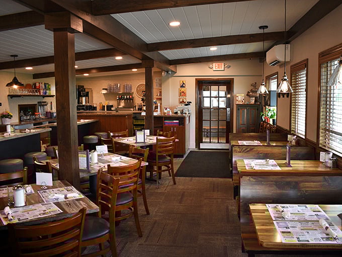 Wooden beams, warm lighting, and tables set for conversation – this isn't just a restaurant, it's Pennsylvania's living room.