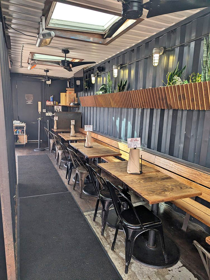 Industrial-chic meets comfort in this no-nonsense interior where wooden communal tables invite you to focus on what really matters: the meat.