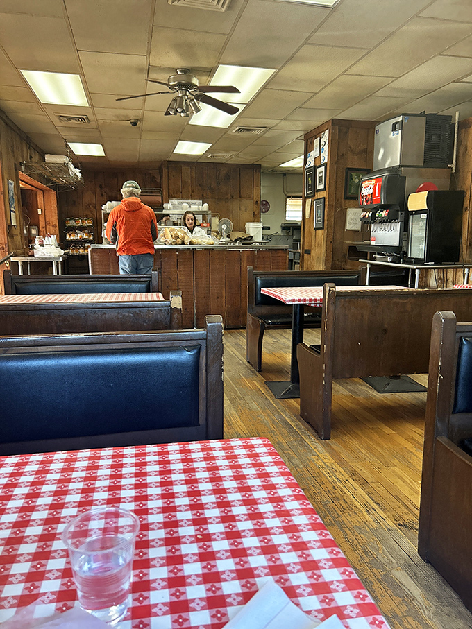 Classic diner vibes with wood paneling and checkered tablecloths &ndash; like stepping into a time machine where smartphones don't exist but perfect sandwiches do. 