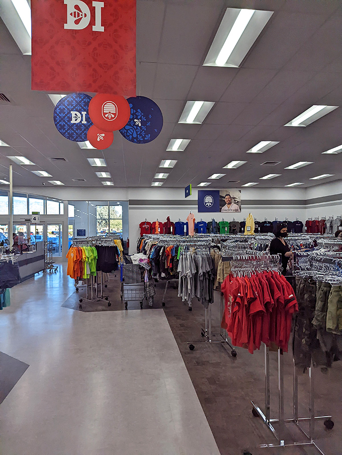 Inside this thrifter's paradise, color-coded racks stretch toward fluorescent horizons, promising discoveries that'll make your wallet do cartwheels.