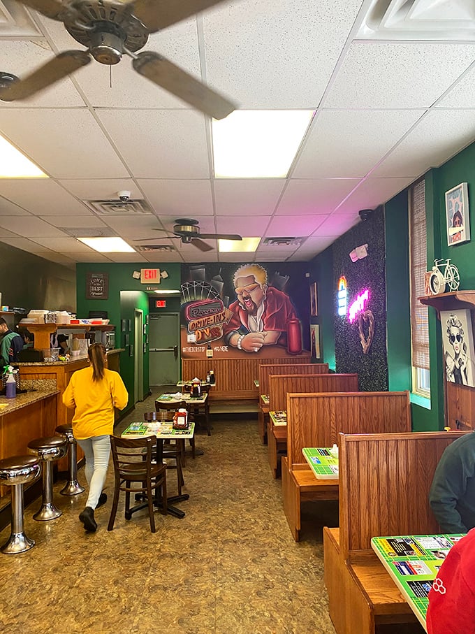 Wood paneling and cozy booths create the perfect backdrop for breakfast magic. That mural says it all &ndash; diners, drive-ins, and deliciousness.