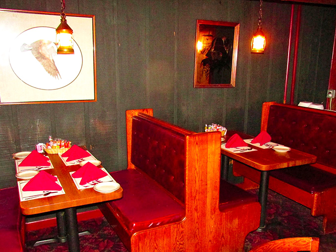 Step into a time machine where red leather booths and green walls create dining room perfection.