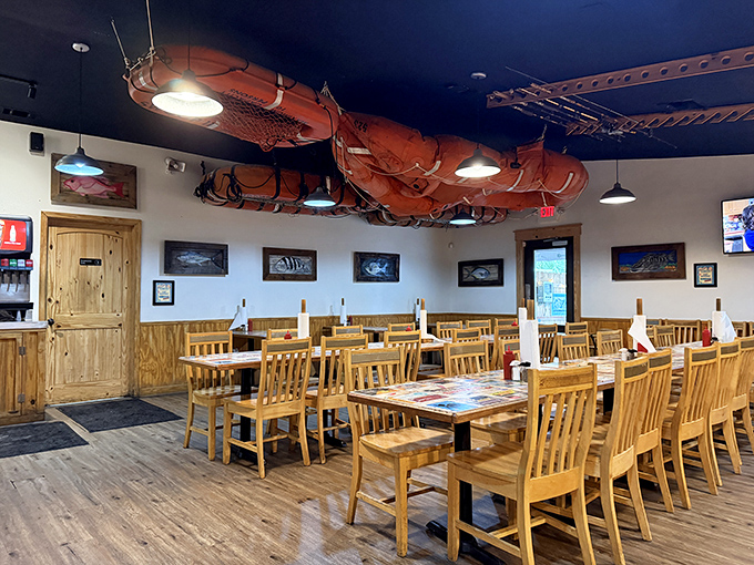 Fishing nets suspended from the ceiling aren't just decoration&mdash;they're a promise of authenticity. The wooden interior creates a maritime charm that whispers, "You're in the right place."