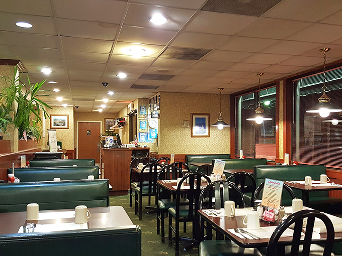 Green vinyl booths and warm wood tones create that perfect time-capsule comfort where conversations flow as freely as the coffee.