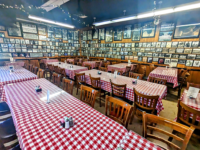 Wall-to-wall memories and red checkered tablecloths - it's like dining inside your favorite family photo album.