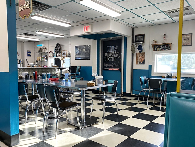 Black and white checkered floors meet chrome and blue accents &ndash; this isn't just retro design, it's a portal to when conversation mattered as much as the coffee.