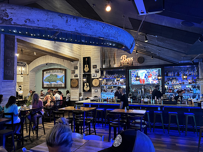 Where rustic meets refined. The bar's blue glow and guitar decor create the perfect backdrop for seafood feasts and storytelling among friends.