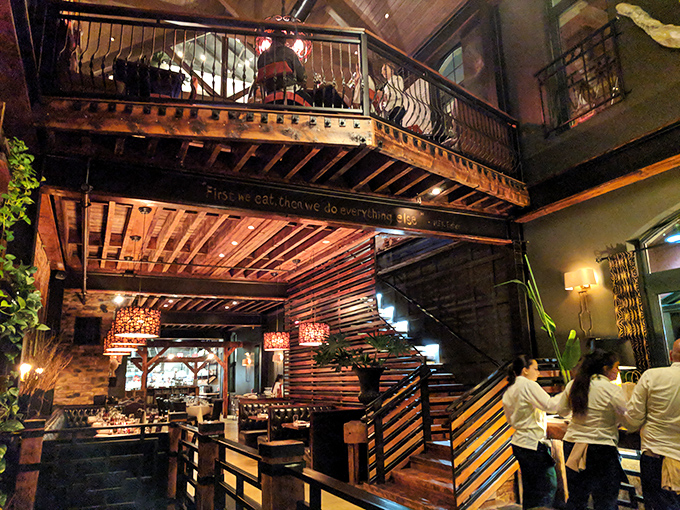 Rustic meets refined in this multi-level dining space where exposed wood beams and ambient lighting create the perfect backdrop for memorable meals.