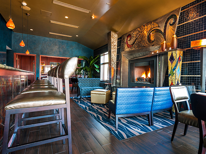 Not your average fireplace lounge! Blue walls and amber lighting create the perfect backdrop for both first dates and anniversary celebrations.