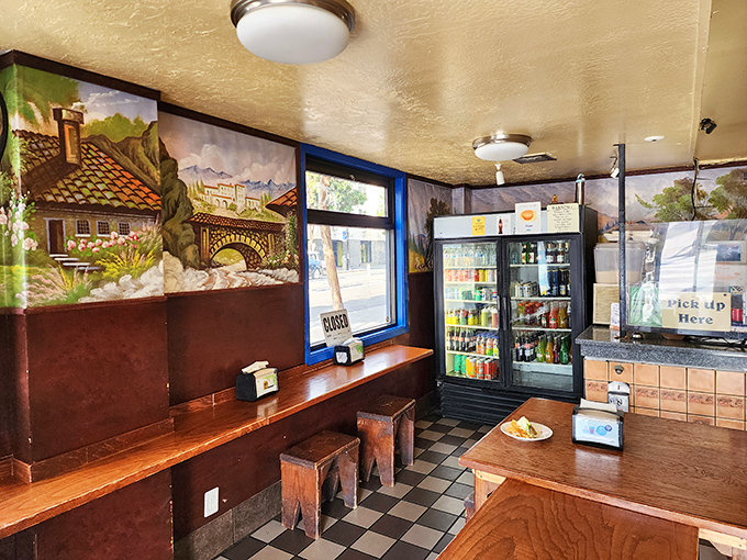 Rustic wooden benches and pastoral murals create the perfect backdrop for life-changing food decisions. Simplicity at its most delicious.